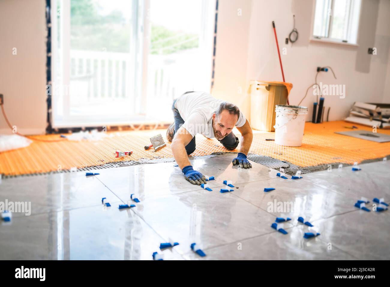 Floor tile install hi-res stock photography and images - Alamy