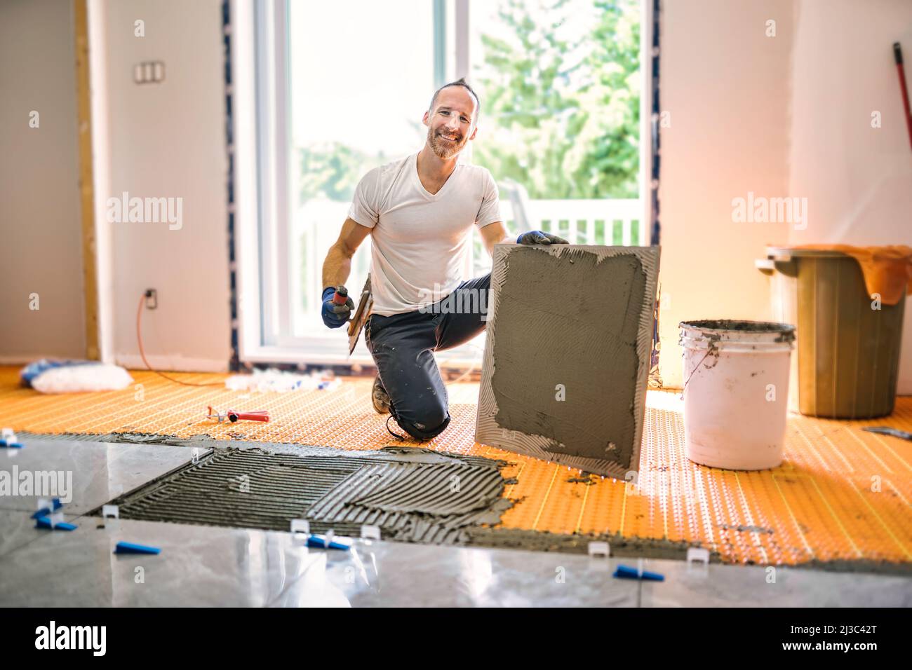 Floor tile install hi-res stock photography and images - Alamy