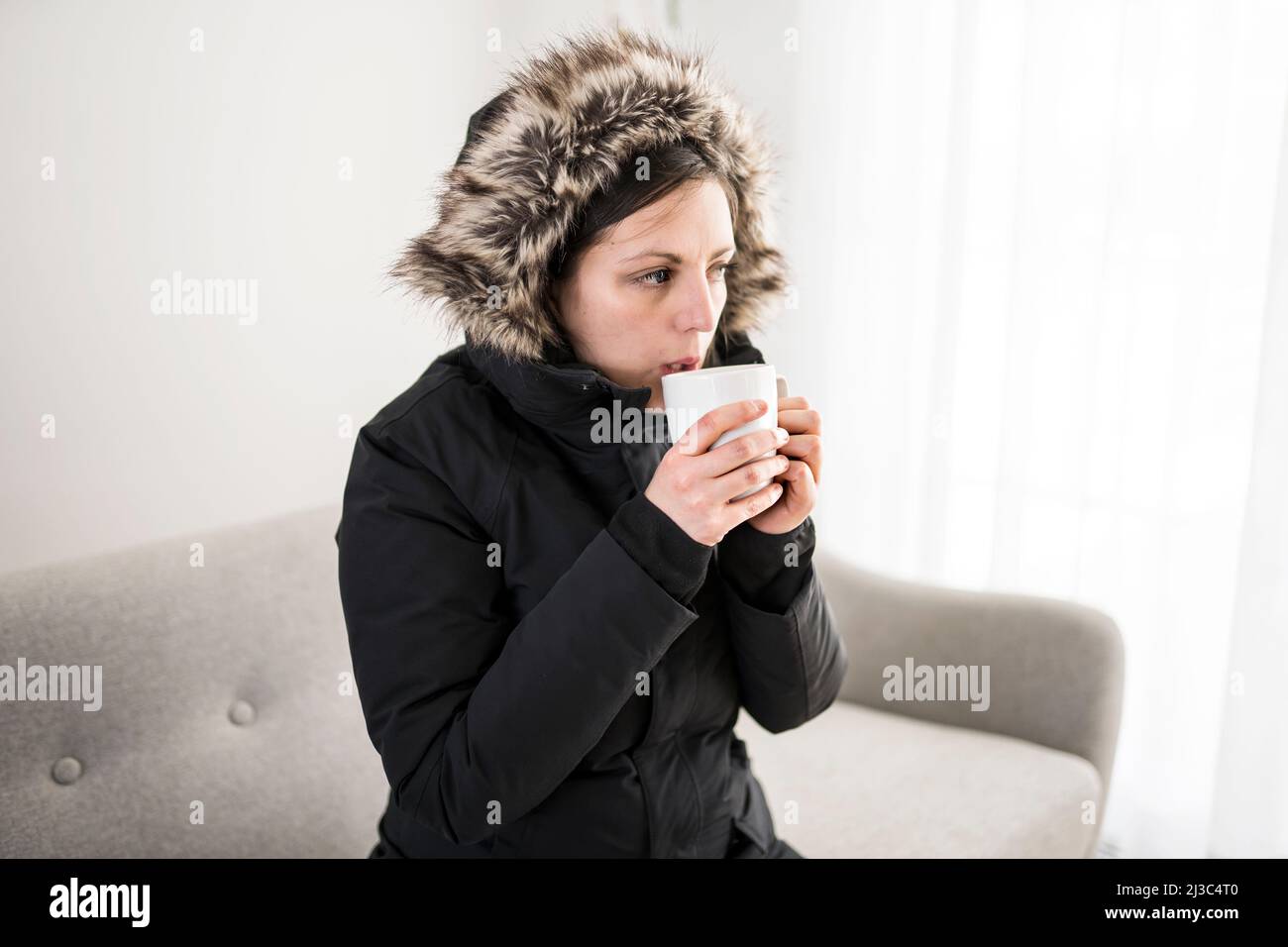Woman cold house hi-res stock photography and images - Alamy
