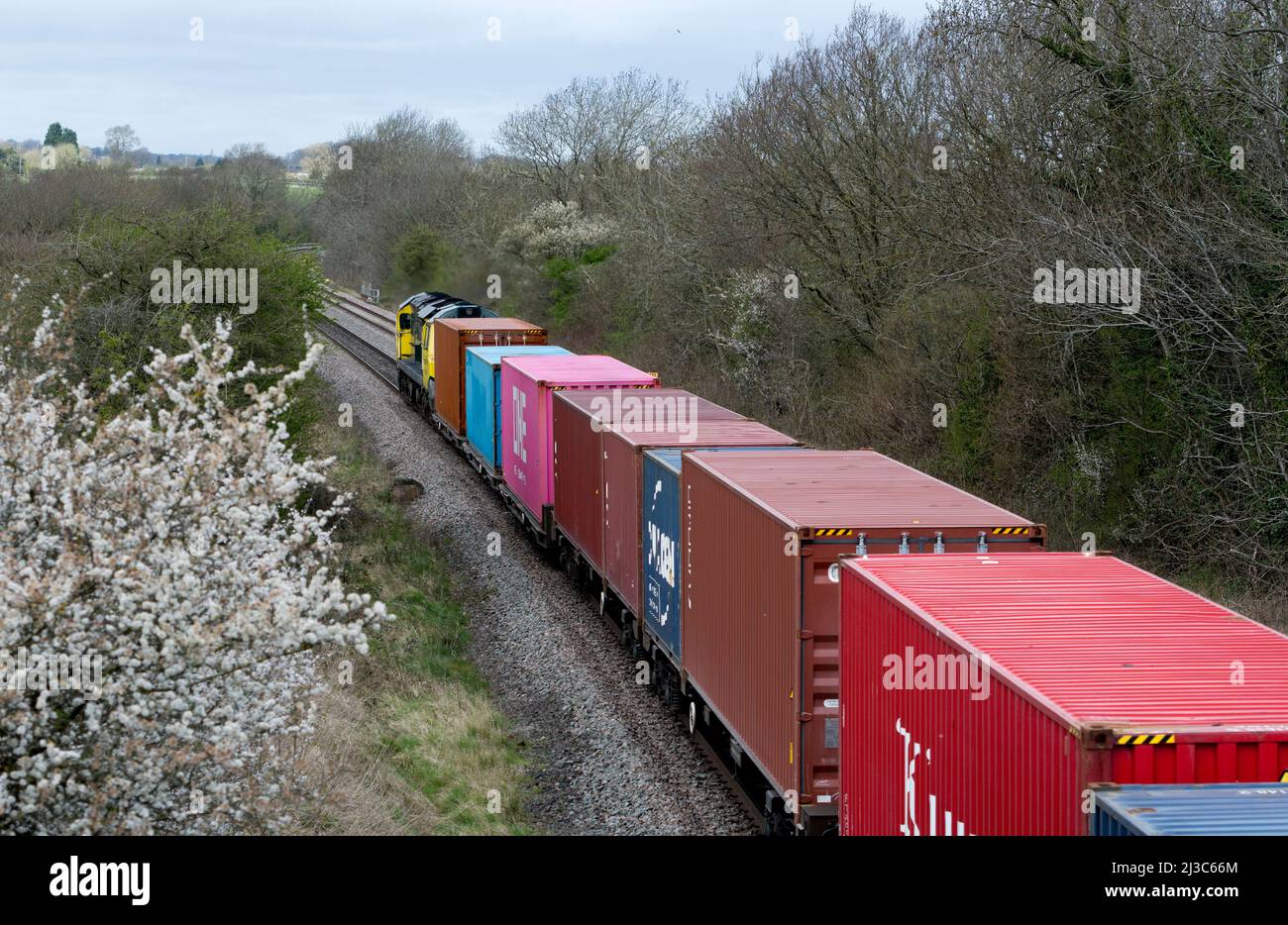 A freightliner train pulled by a Class 70 diesel locomotive at Shrewley ...