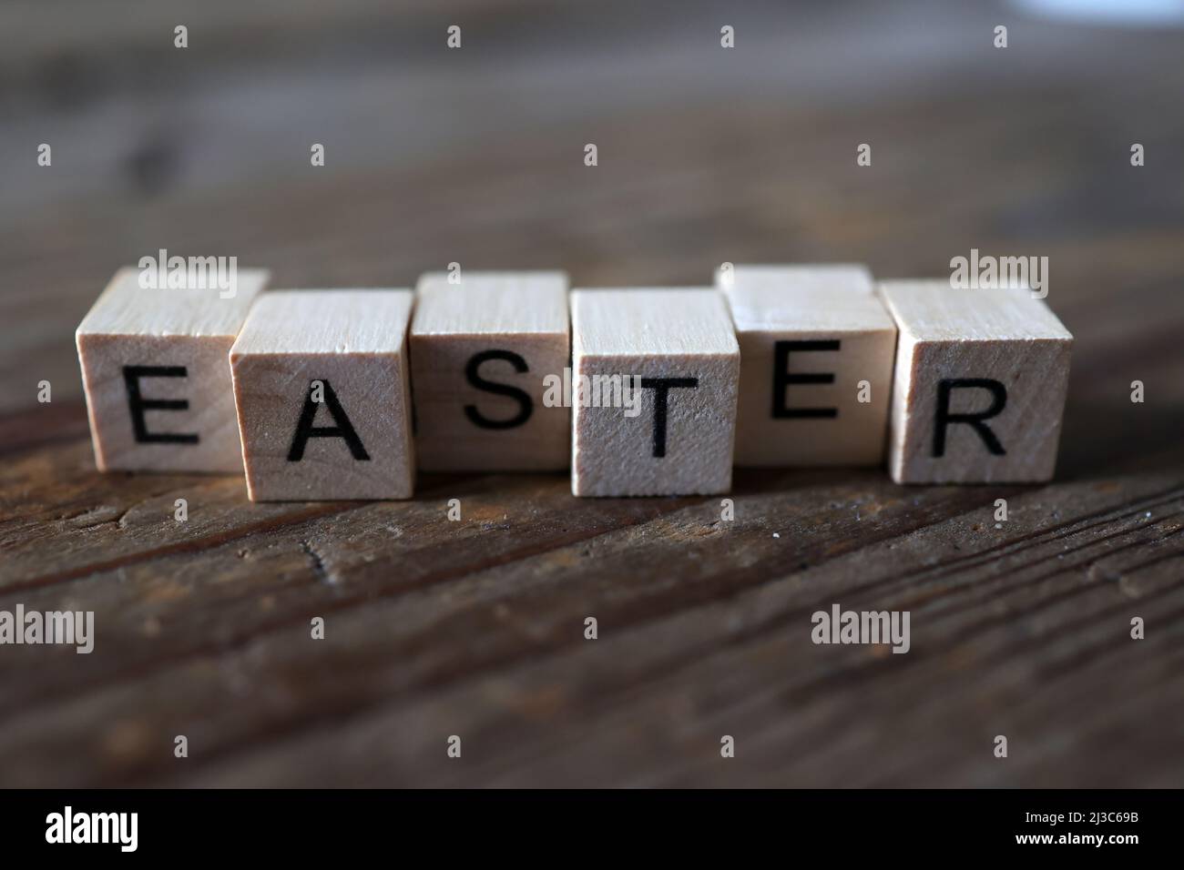 The word EASTER is laid out from wooden cubes Stock Photo - Alamy
