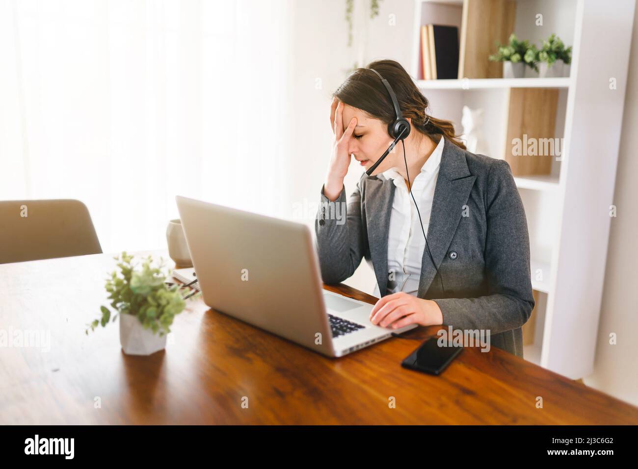 Woman with headset sad hi-res stock photography and images - Alamy