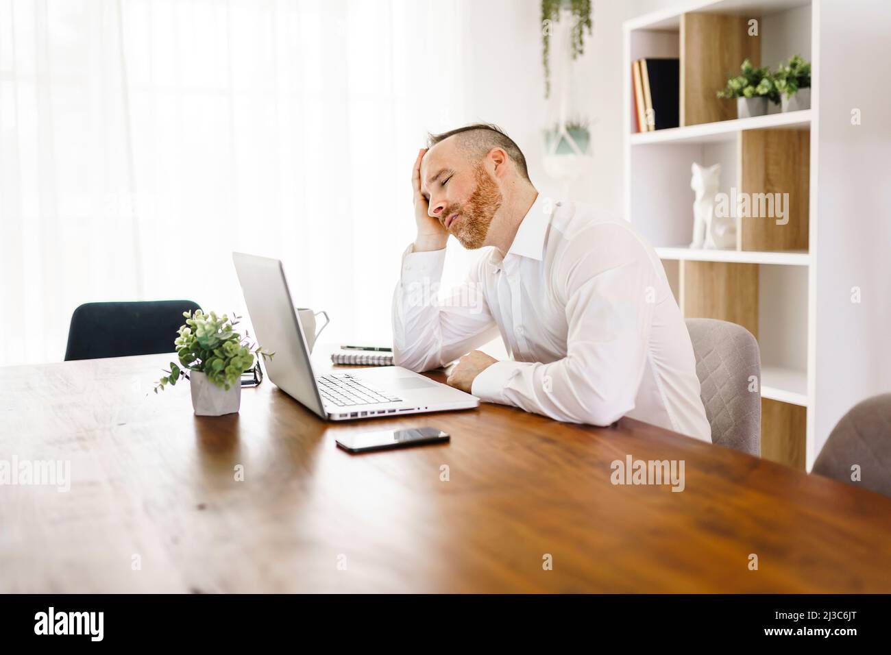 frustrated and sad man working on laptop at home Stock Photo - Alamy