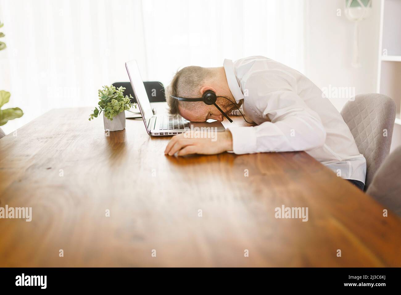 frustrated and sad man working on laptop at home Stock Photo - Alamy