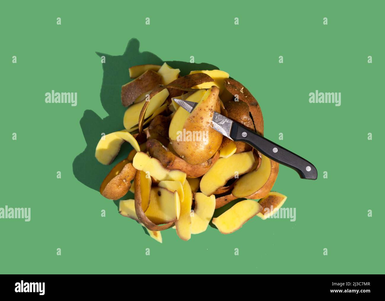 Concept of Stop food waste day. Potato peels are one of the most ...