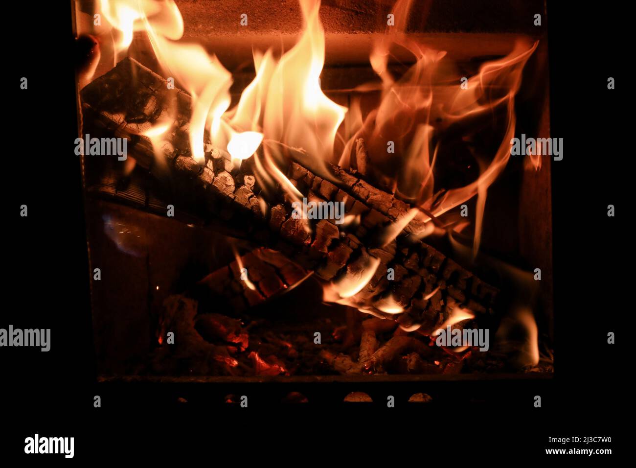Footage of a bright colored dancing flames in fireplace. Close up of ...