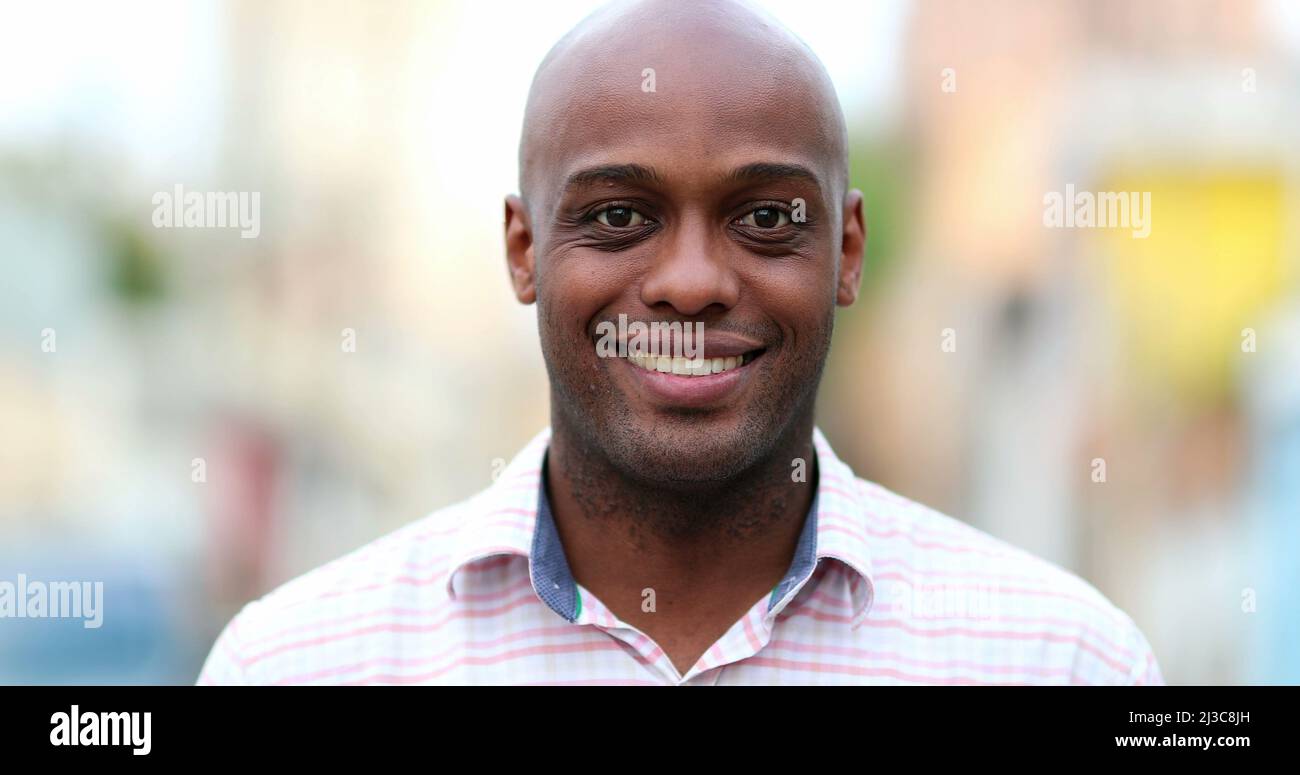 Happy African man smiling at camera, portrait black guy standing ...