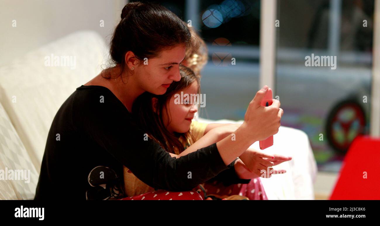 Mother holding phone talking video with family member, distant calling ...