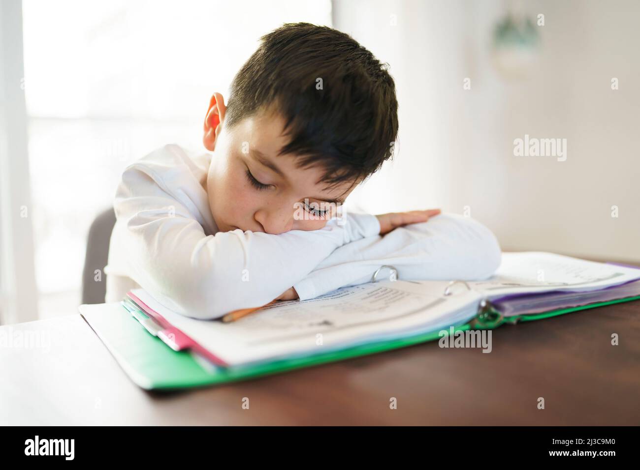 Child writing classroom sad hi-res stock photography and images - Alamy