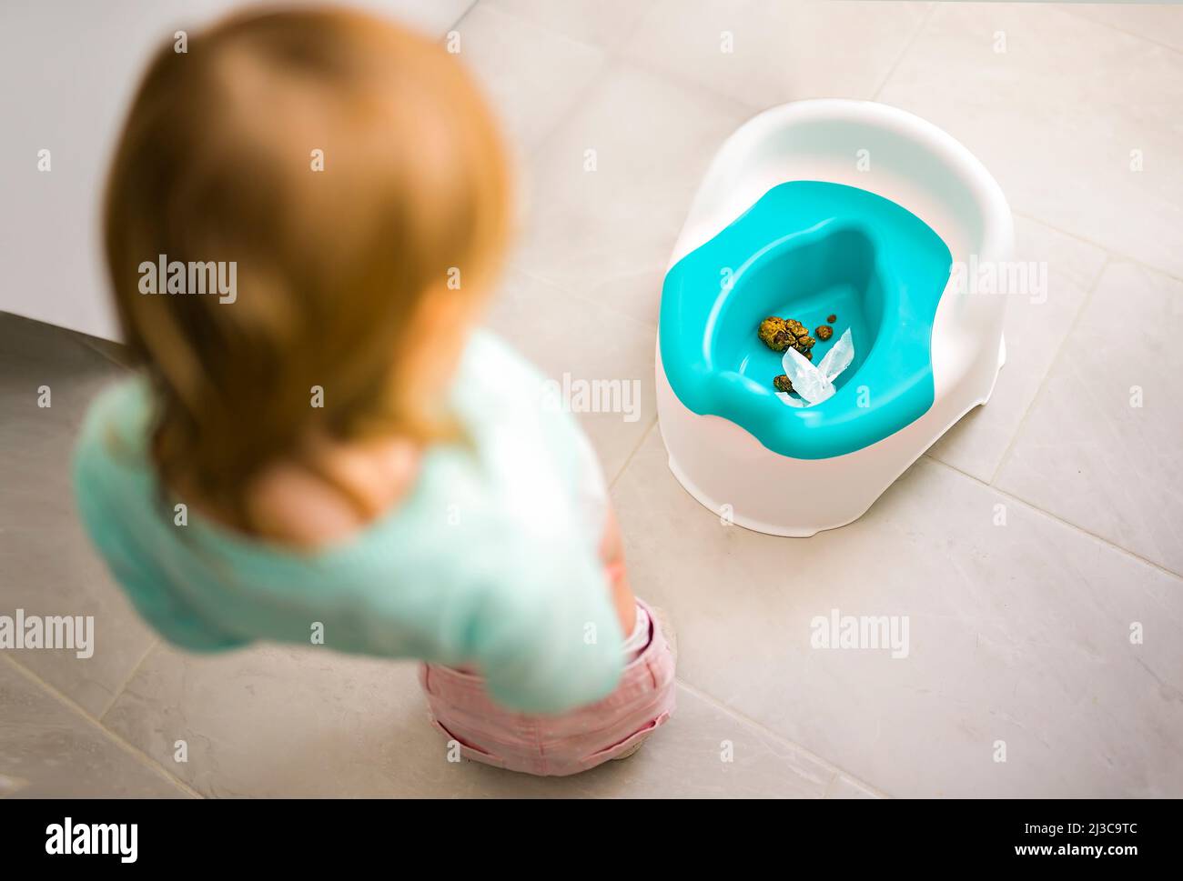 cute child girl is looking chamberpot poo on the bathroom Stock Photo ...