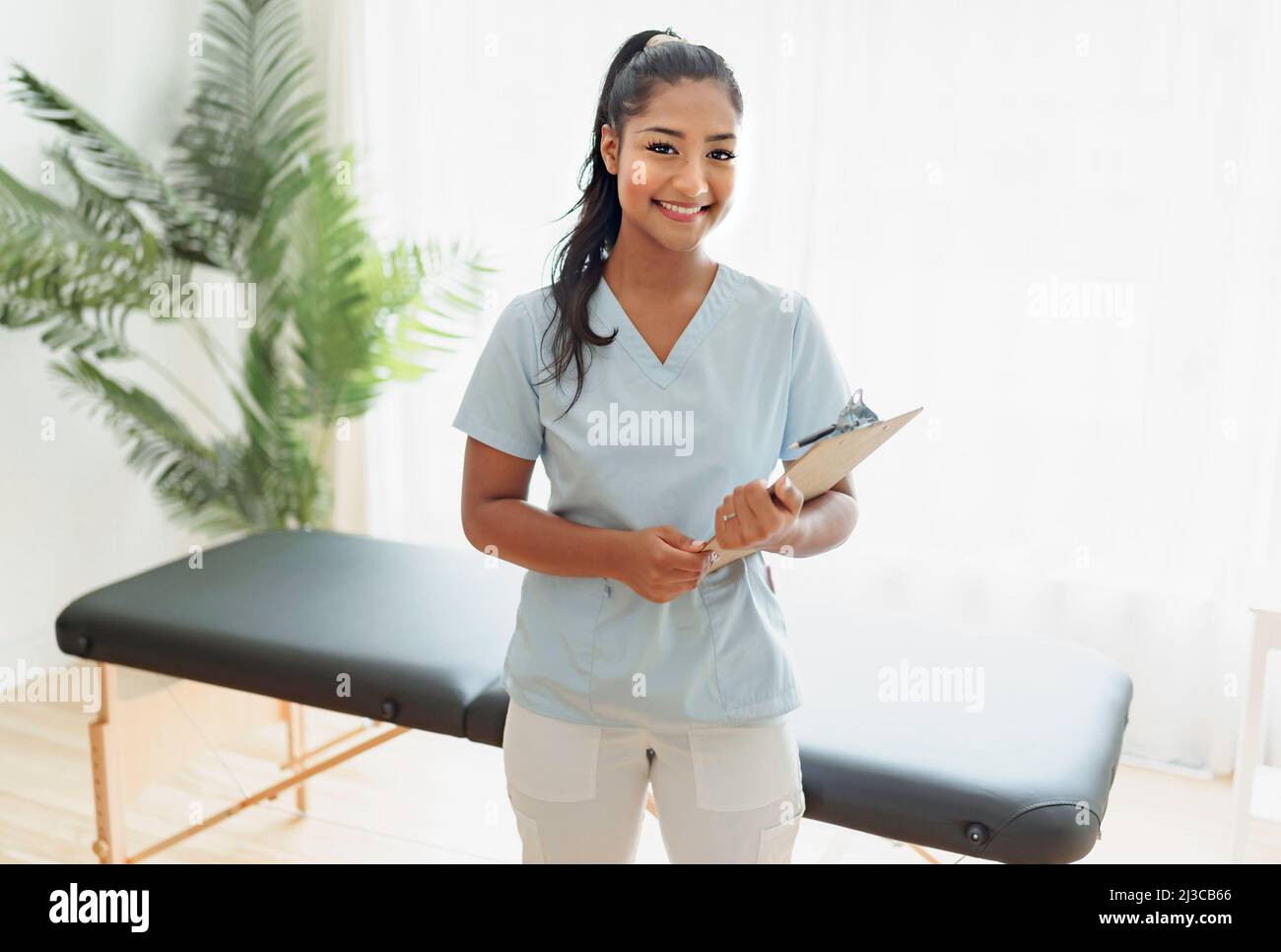 Portrait of young black woman physiotherapist on a physio center Stock ...