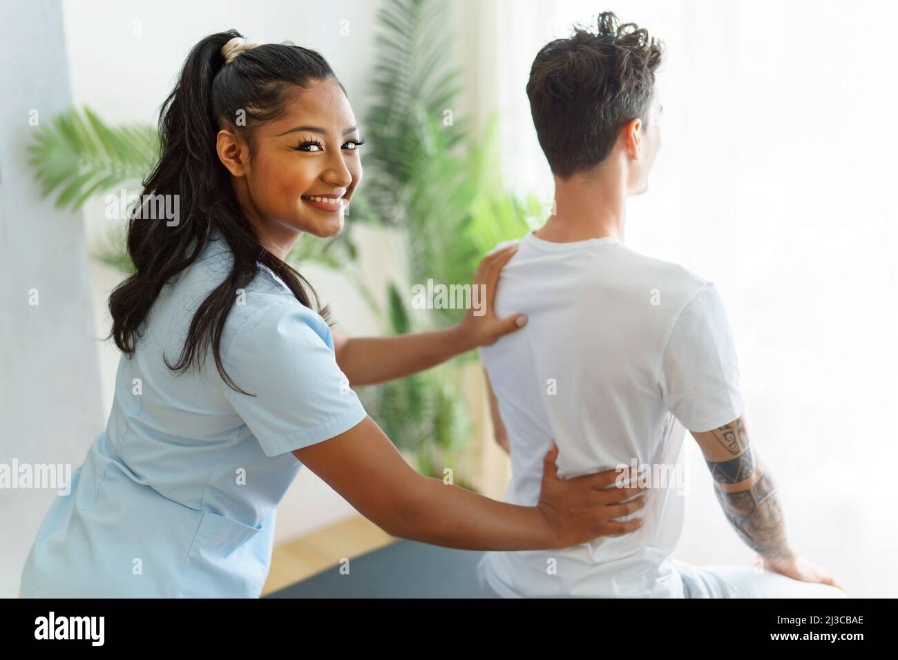 black rehabilitation woman physiotherapy at physio clinic with customer Stock Photo - Alamy