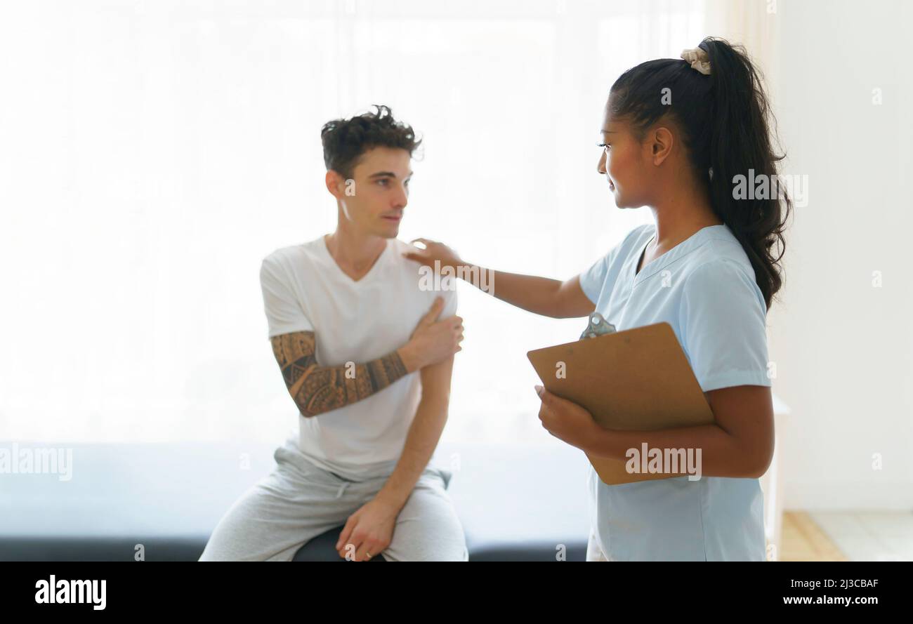 black rehabilitation woman physiotherapy at physio clinic with customer Stock Photo - Alamy