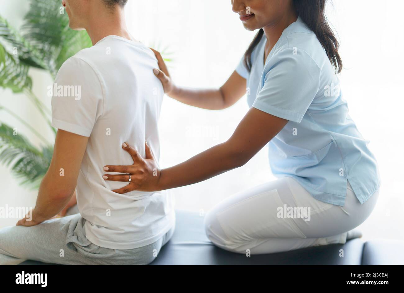 black rehabilitation woman physiotherapy at physio clinic with customer Stock Photo - Alamy
