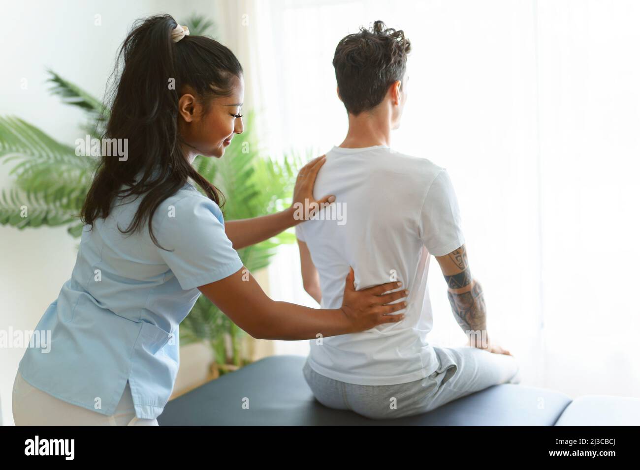 black rehabilitation woman physiotherapy at physio clinic with customer Stock Photo - Alamy