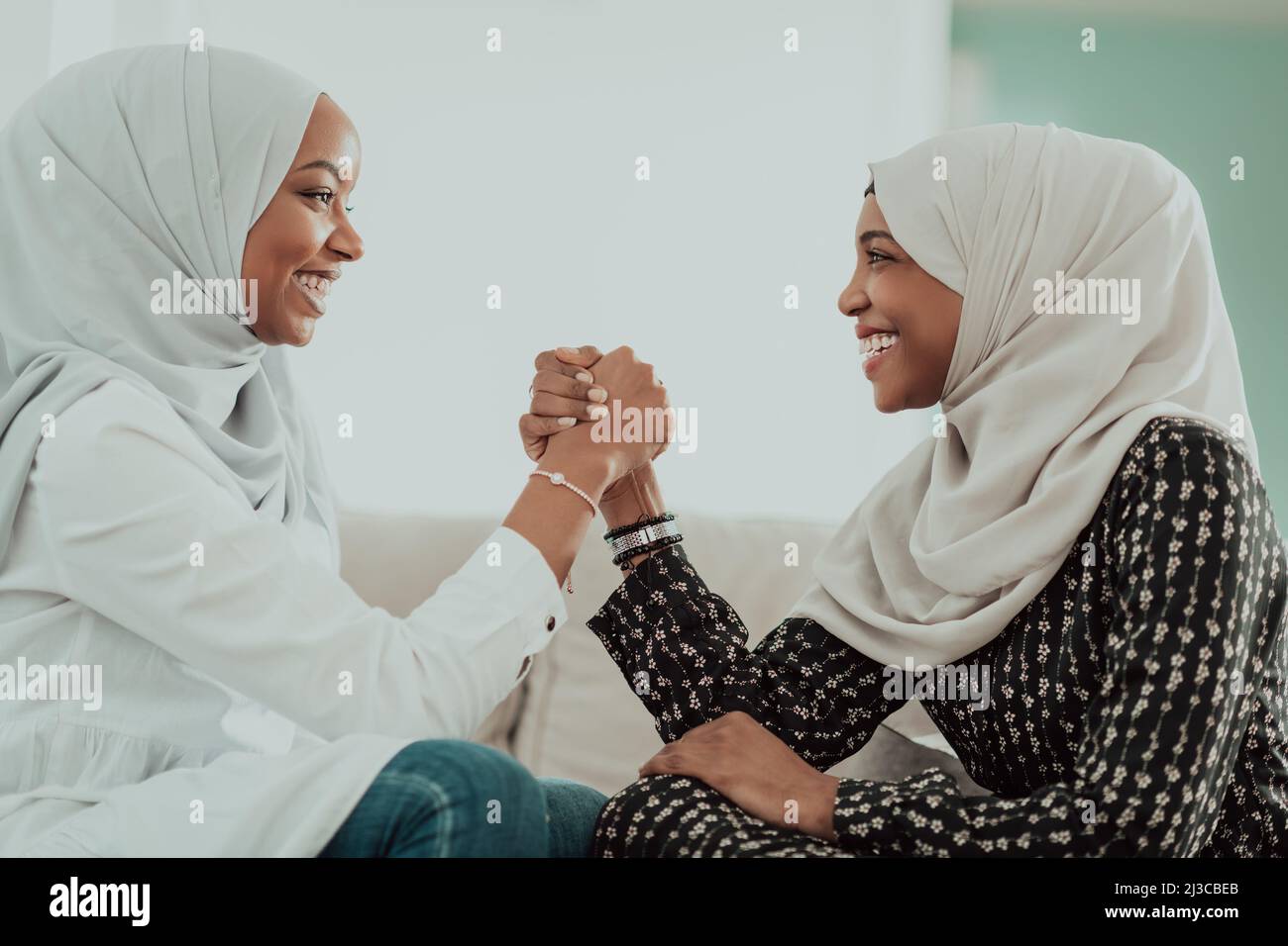 African woman arm wrestling conflict concept, disagreement and ...