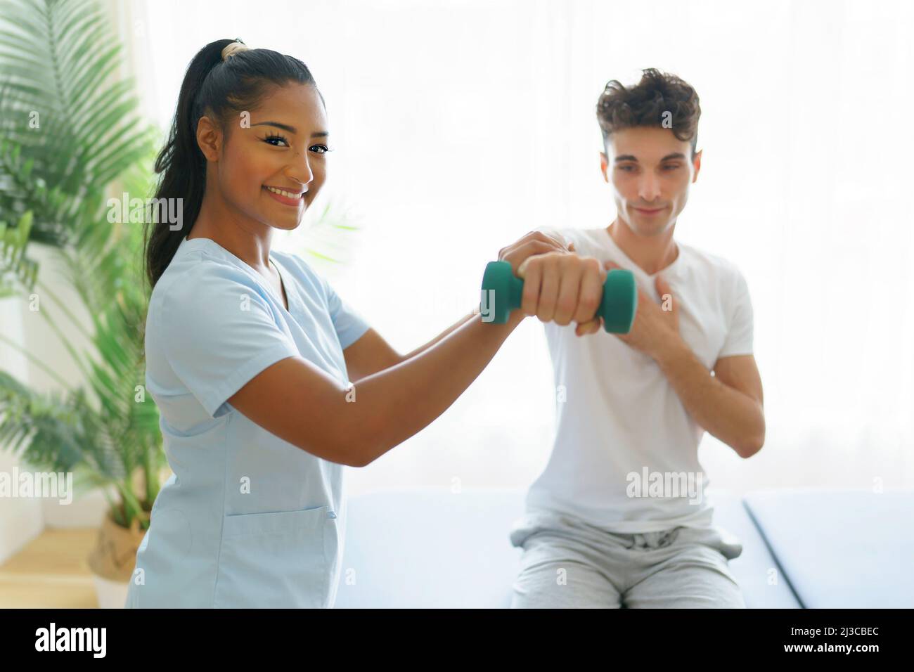 black rehabilitation woman physiotherapy at physio clinic with customer Stock Photo - Alamy