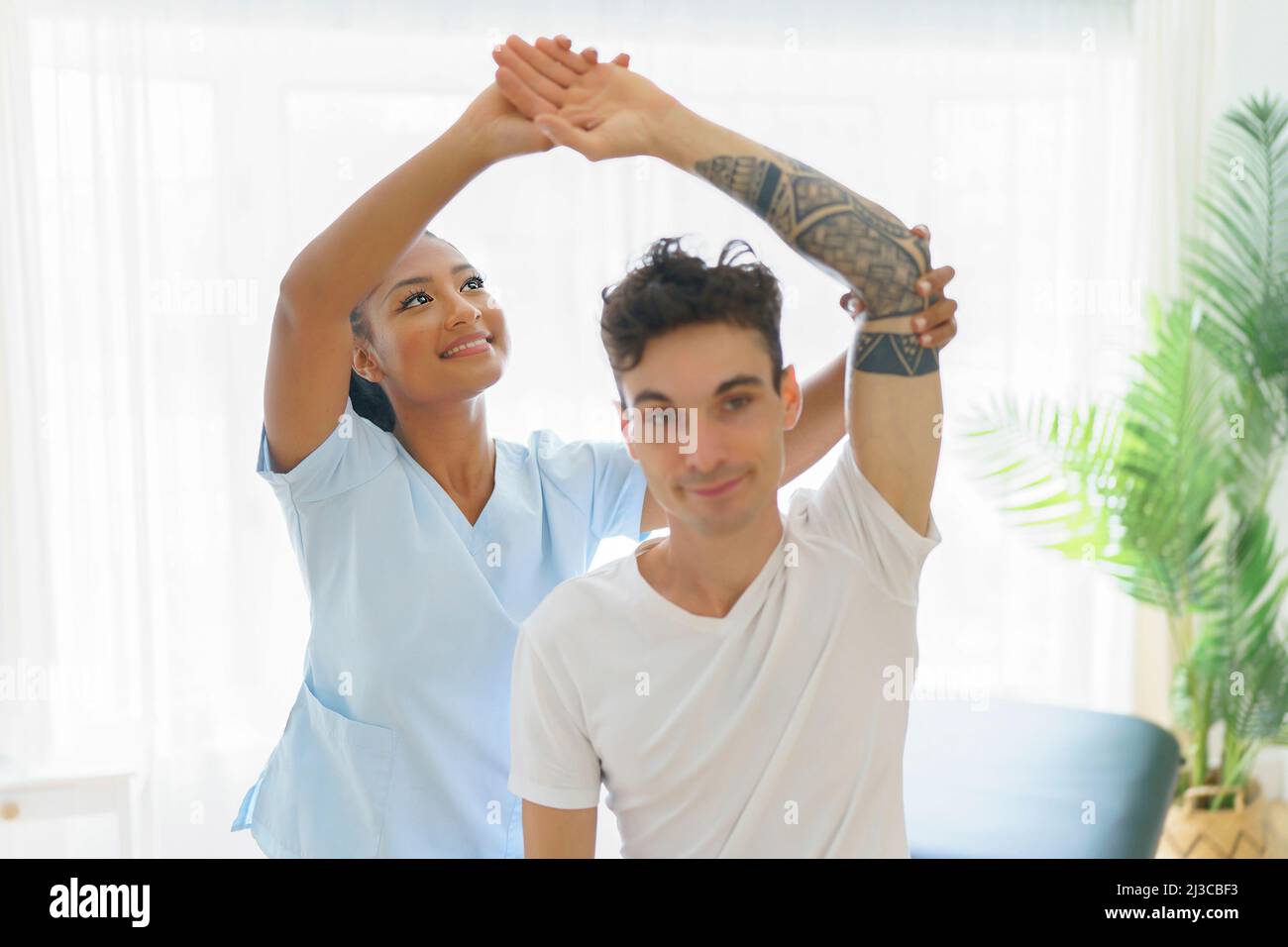 black rehabilitation woman physiotherapy at physio clinic with customer Stock Photo - Alamy