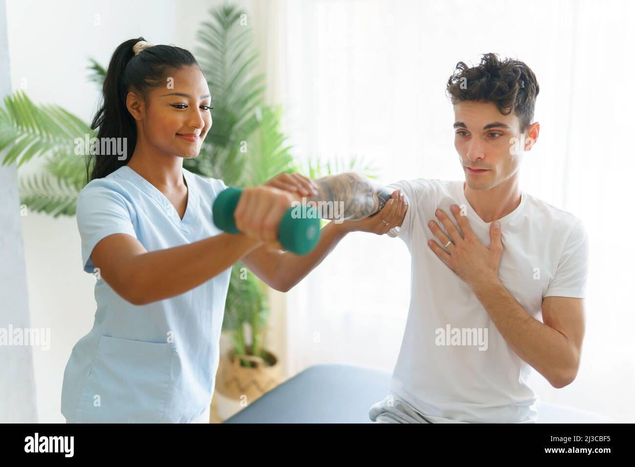 black rehabilitation woman physiotherapy at physio clinic with customer Stock Photo - Alamy