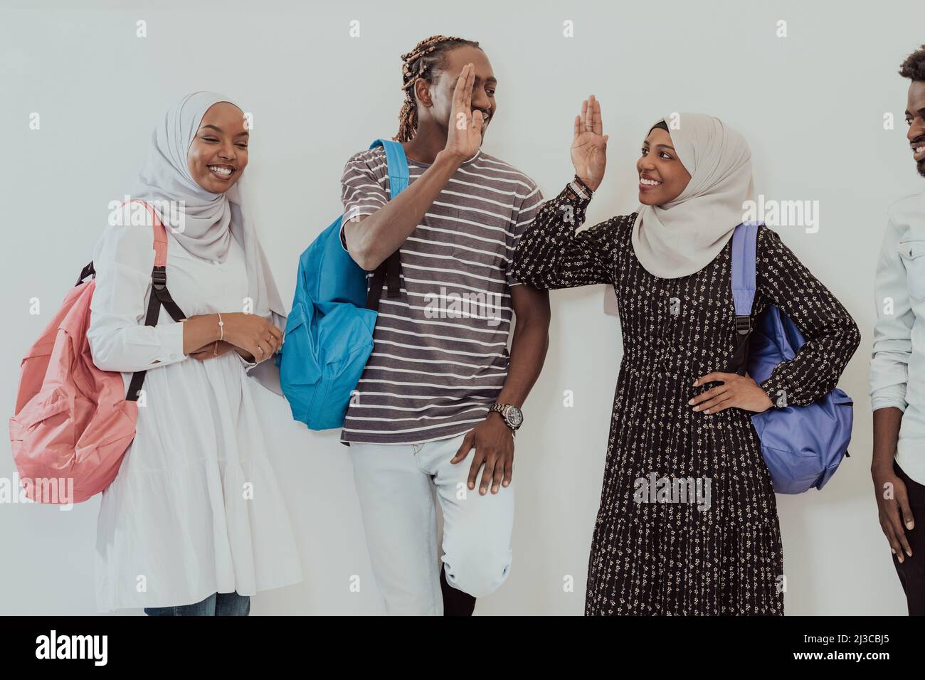 Photo of a group of happy african students talking and meeting together ...