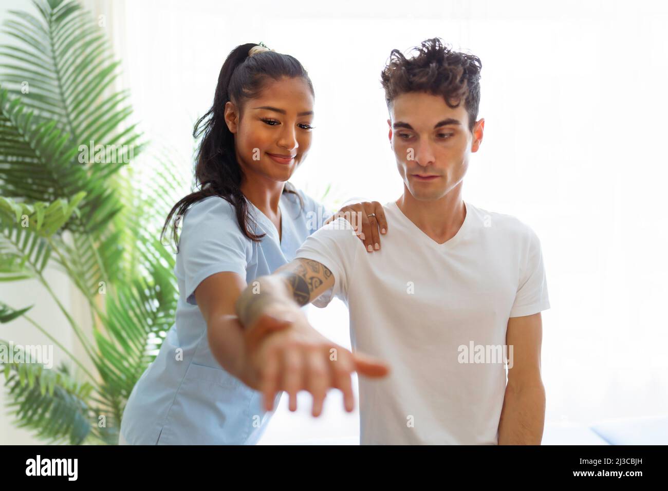 black rehabilitation woman physiotherapy at physio clinic with customer Stock Photo - Alamy
