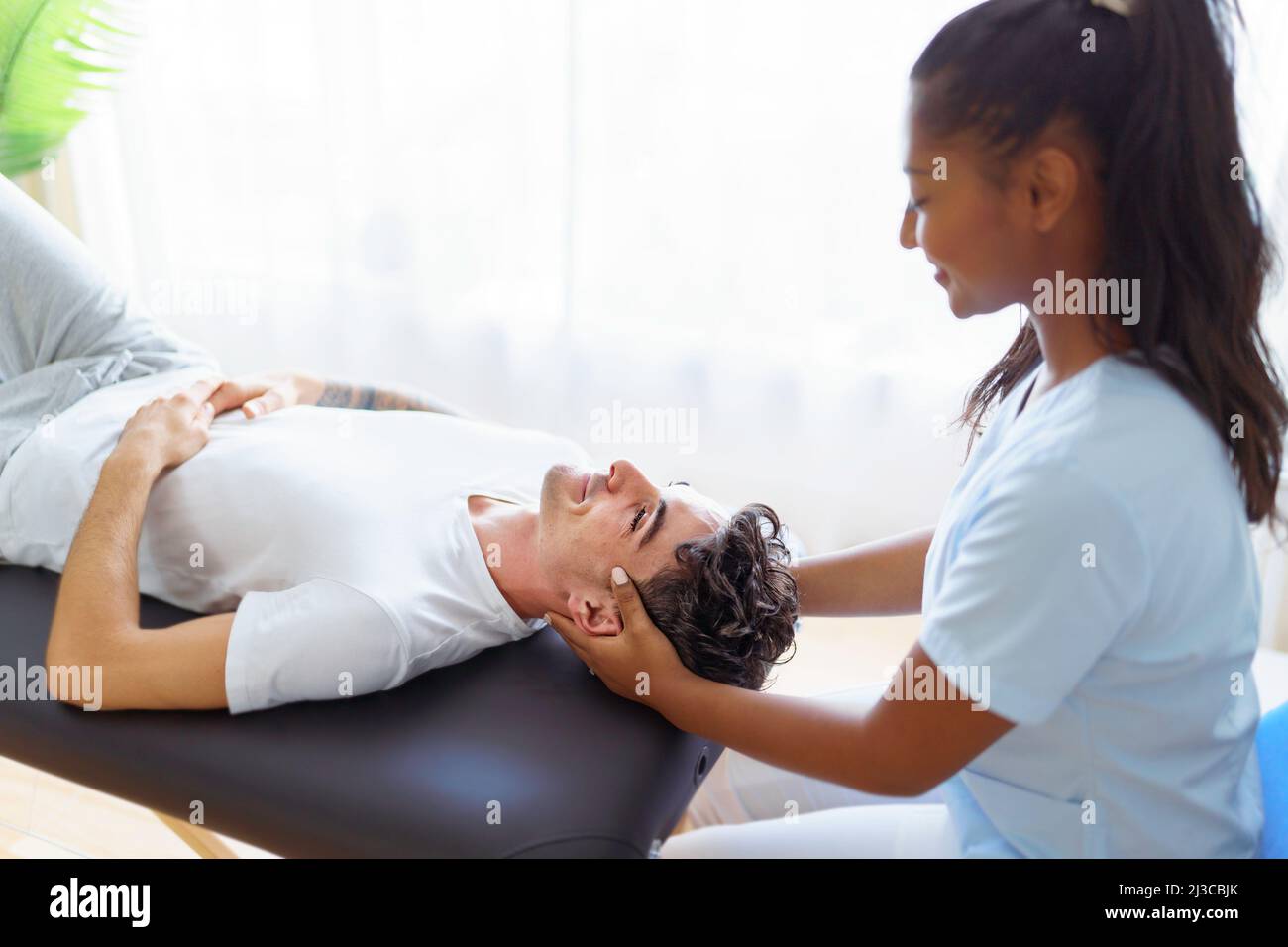 black rehabilitation woman physiotherapy at physio clinic with customer Stock Photo - Alamy