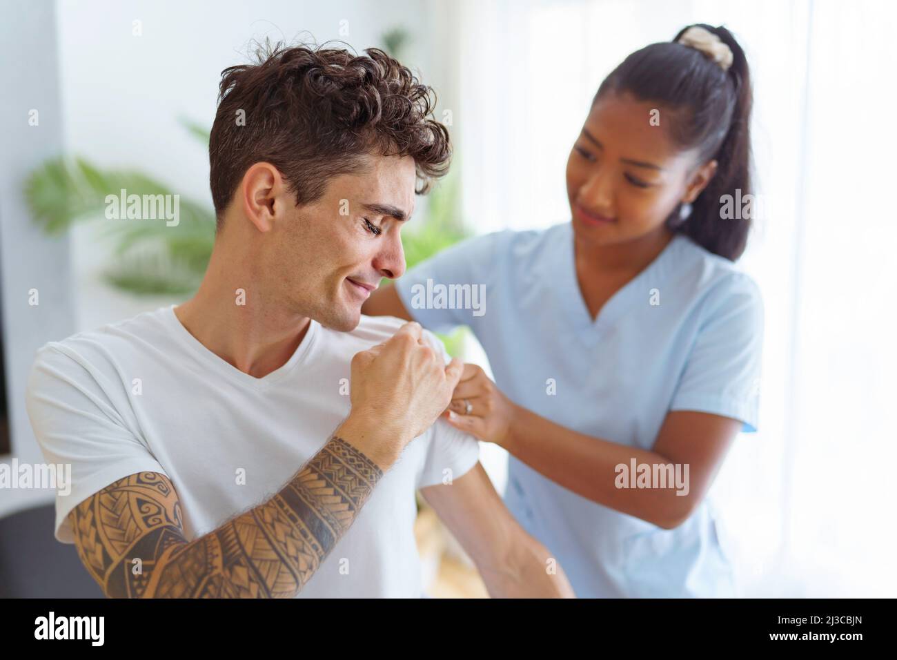 black rehabilitation woman physiotherapy at physio clinic with customer Stock Photo - Alamy