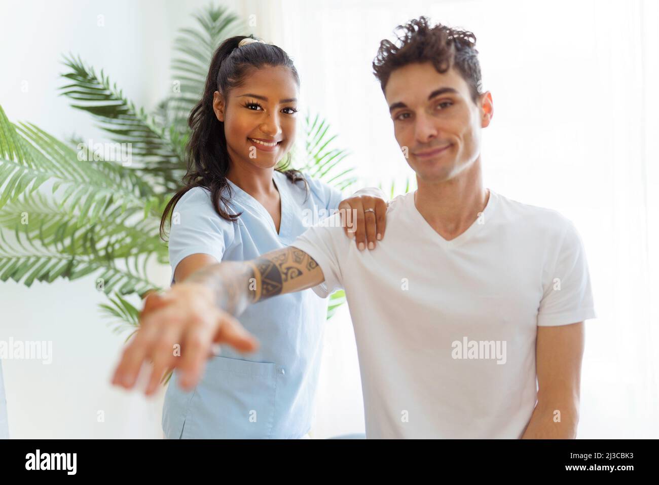 black rehabilitation woman physiotherapy at physio clinic with customer Stock Photo - Alamy
