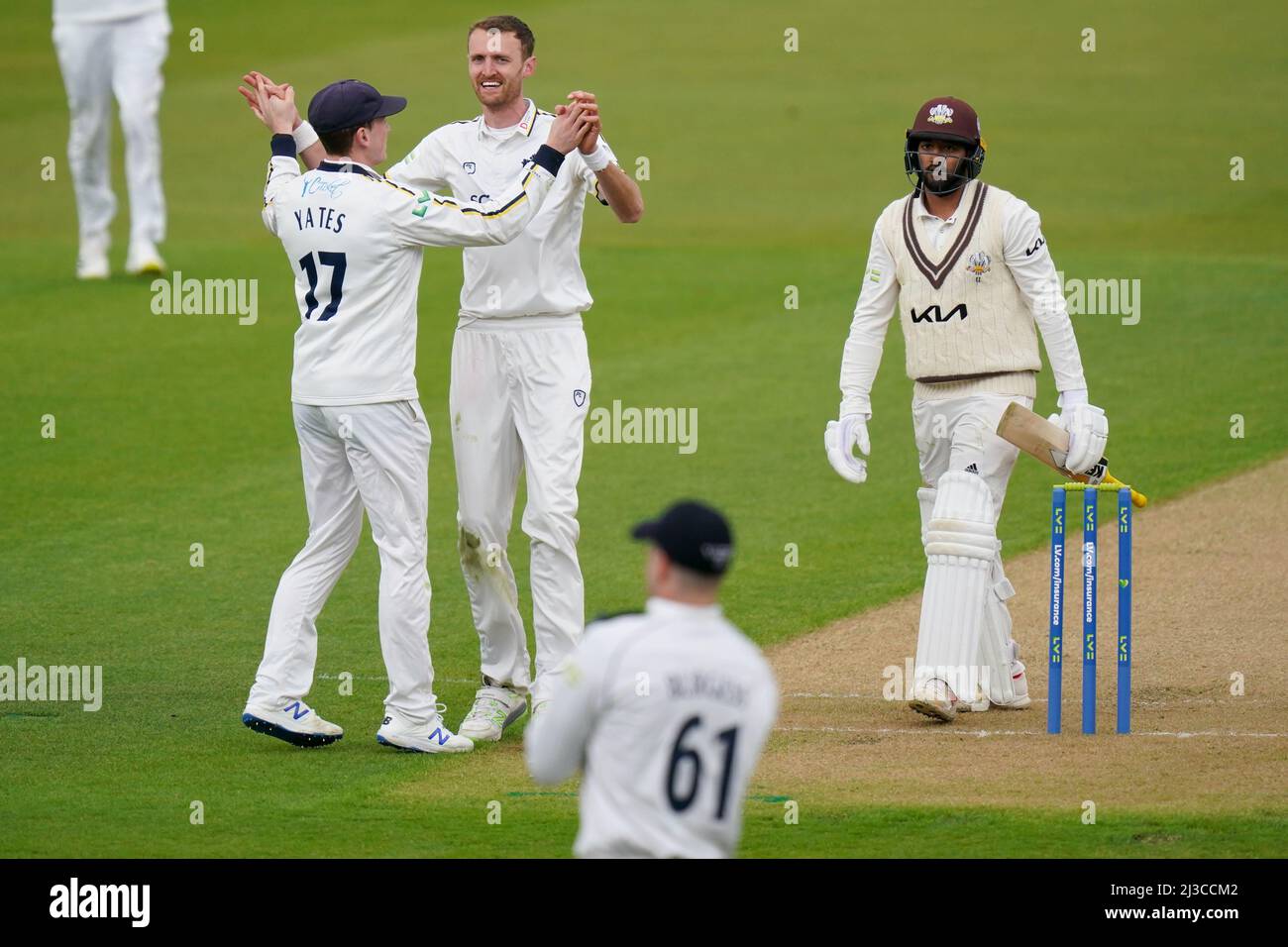 Warwickshire bowler Olly Hannon-Dalby (centre) celebrates the wicket of ...