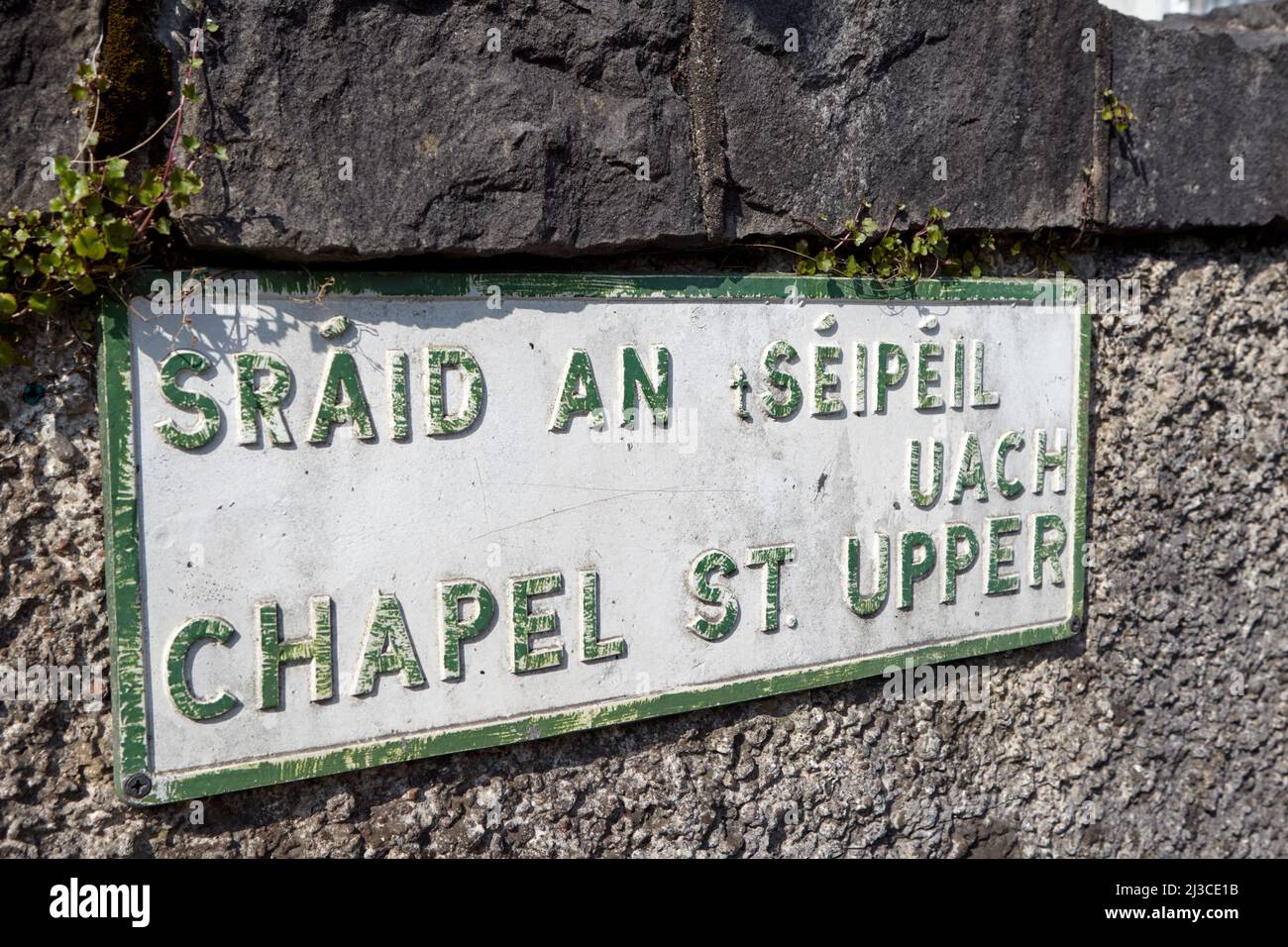 old roadsign in irish and english for chapel street upper castlebar ...