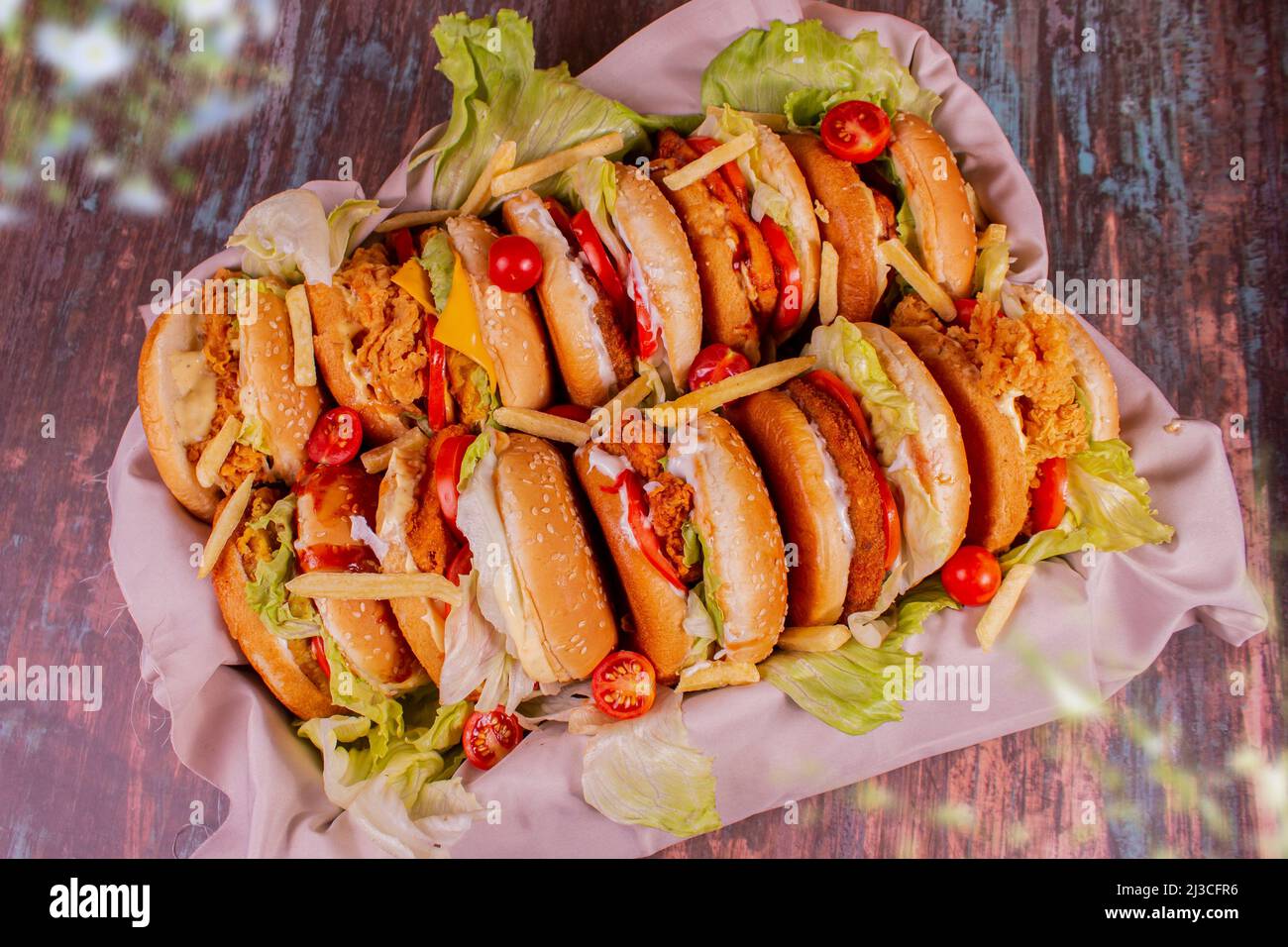 Different hamburgers seen from above with french fries in the middle of ...