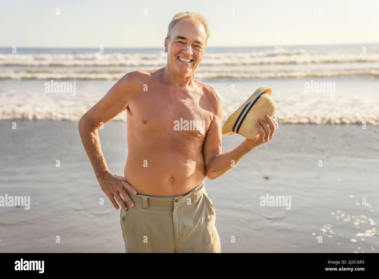 Senior men having great time on beach at the sunset Stock Photo - Alamy