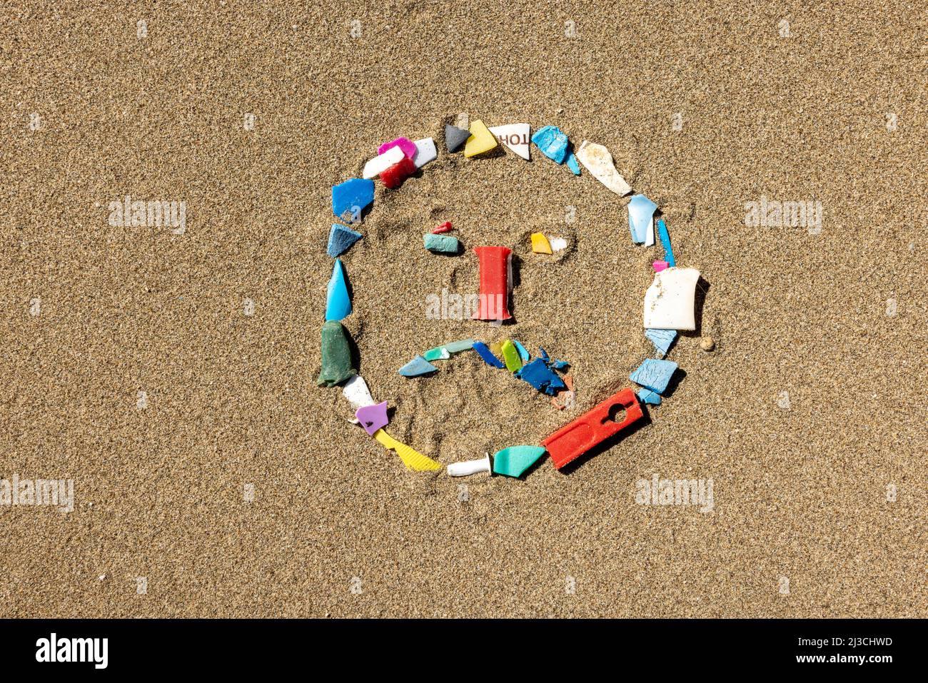 sad face made of plastic waste found on a beach Stock Photo - Alamy