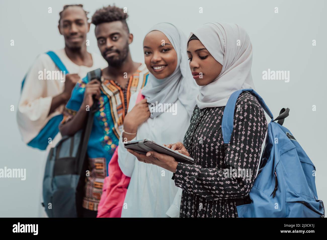 Photo of a group of happy african students talking and meeting together ...