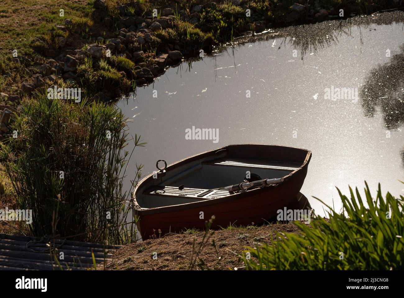 Western Cape, South Africa. 2022. A small rowing boat with oars on ...
