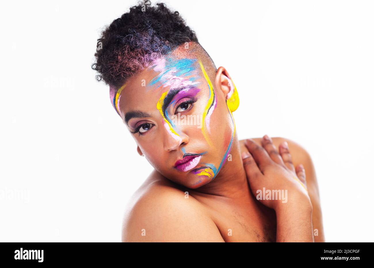 I am who I am. Portrait of a gender fluid young man wearing face paint ...