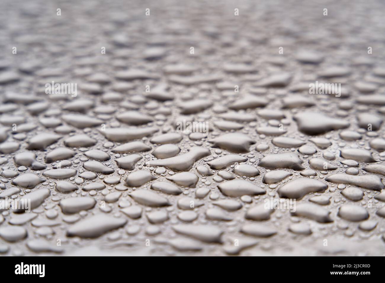 Water drops on stainless steel metal plate after rain Stock Photo - Alamy