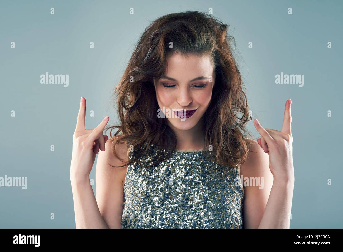Woman making hand gesture rock hi-res stock photography and images - Alamy