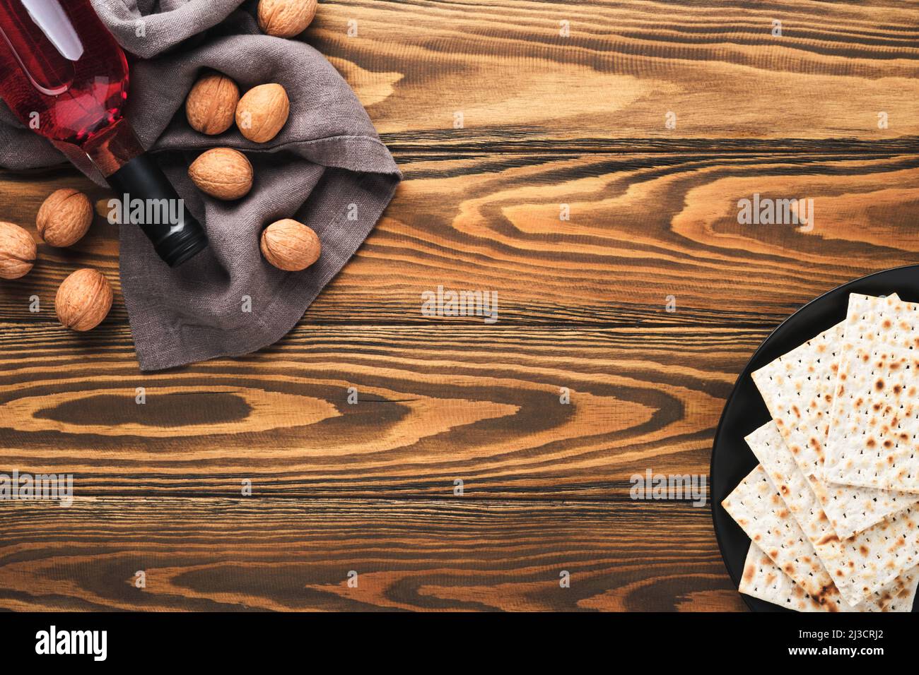 Passover celebration concept. Matzah, red kosher and walnut ...