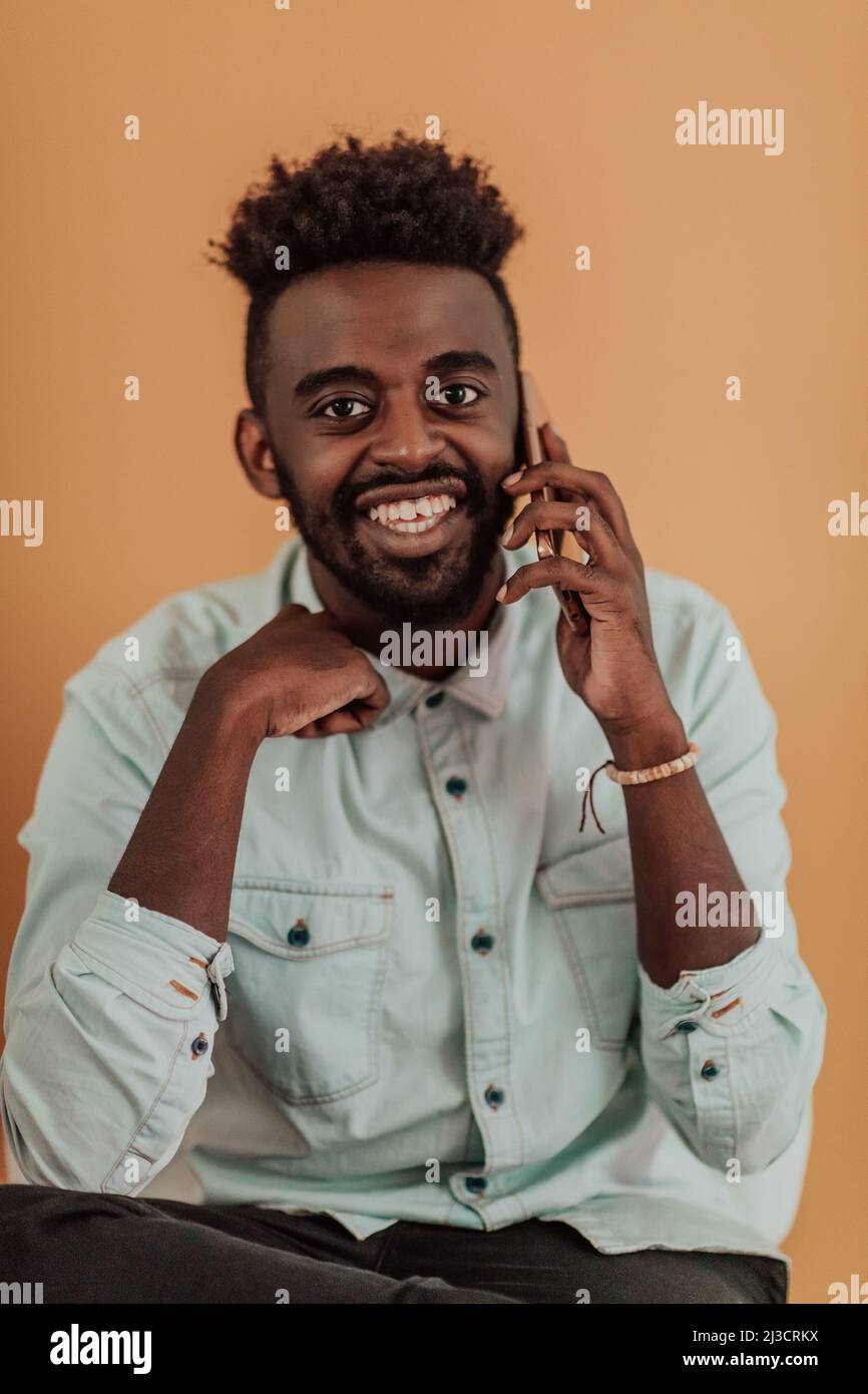 African student using laptop computer to study and make business ...