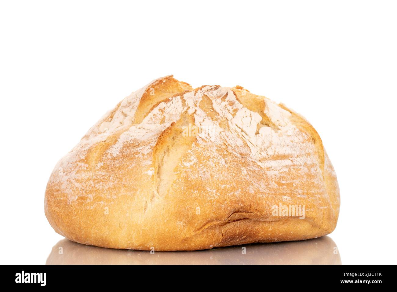 One loaf of fresh fragrant white wheat bread, macro, isolated on a ...