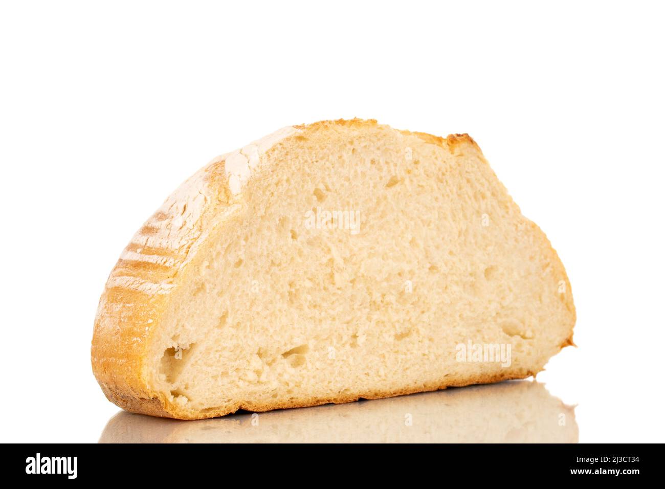 One half of a loaf of fresh fragrant white wheat bread, macro, isolated ...