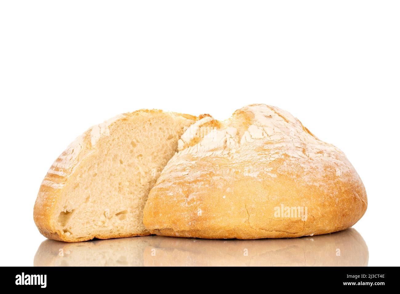 Two halves of a loaf of fresh fragrant white wheat bread, macro ...
