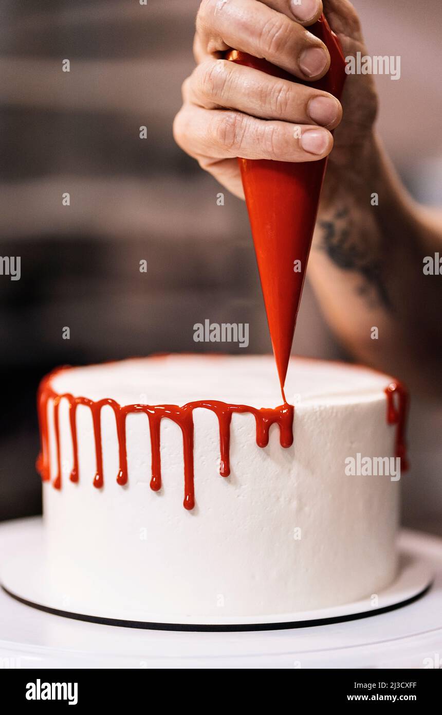Unrecognizable Woman spinning plate with delicious cake and squeezing ...