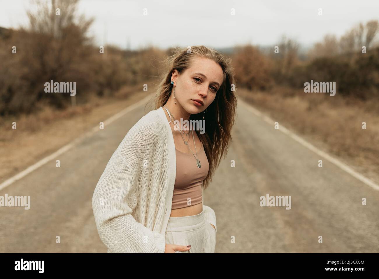 Full body side view of tranquil female lying on sports mat in Wind ...