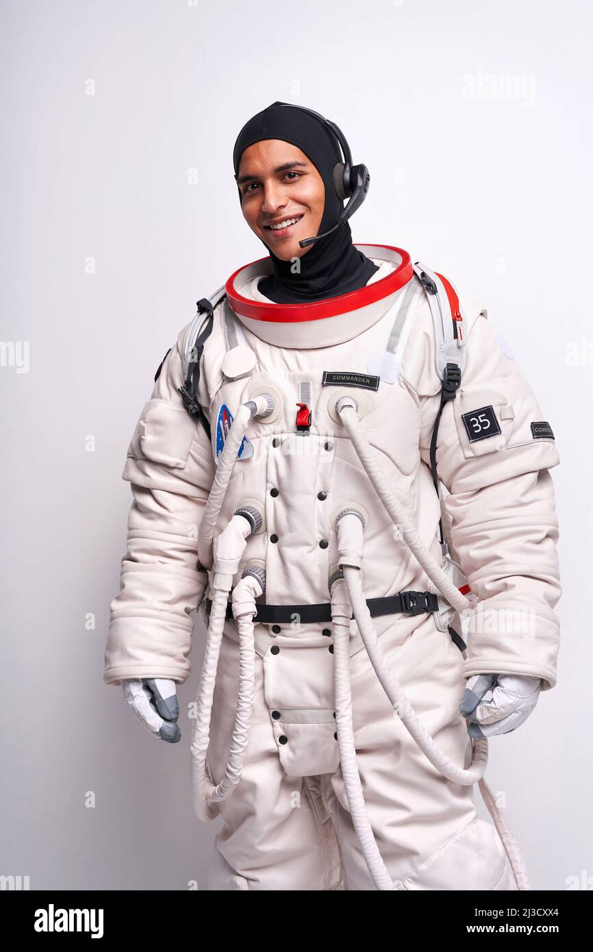 Young happy Colombian cosmonaut dressed in spacesuit and headset ready ... Young happy Colombian cosmonaut dressed in spacesuit and headset ready ...