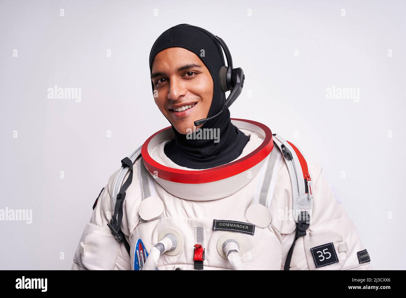 Young happy Colombian cosmonaut dressed in spacesuit and headset ready ... Young happy Colombian cosmonaut dressed in spacesuit and headset ready ...