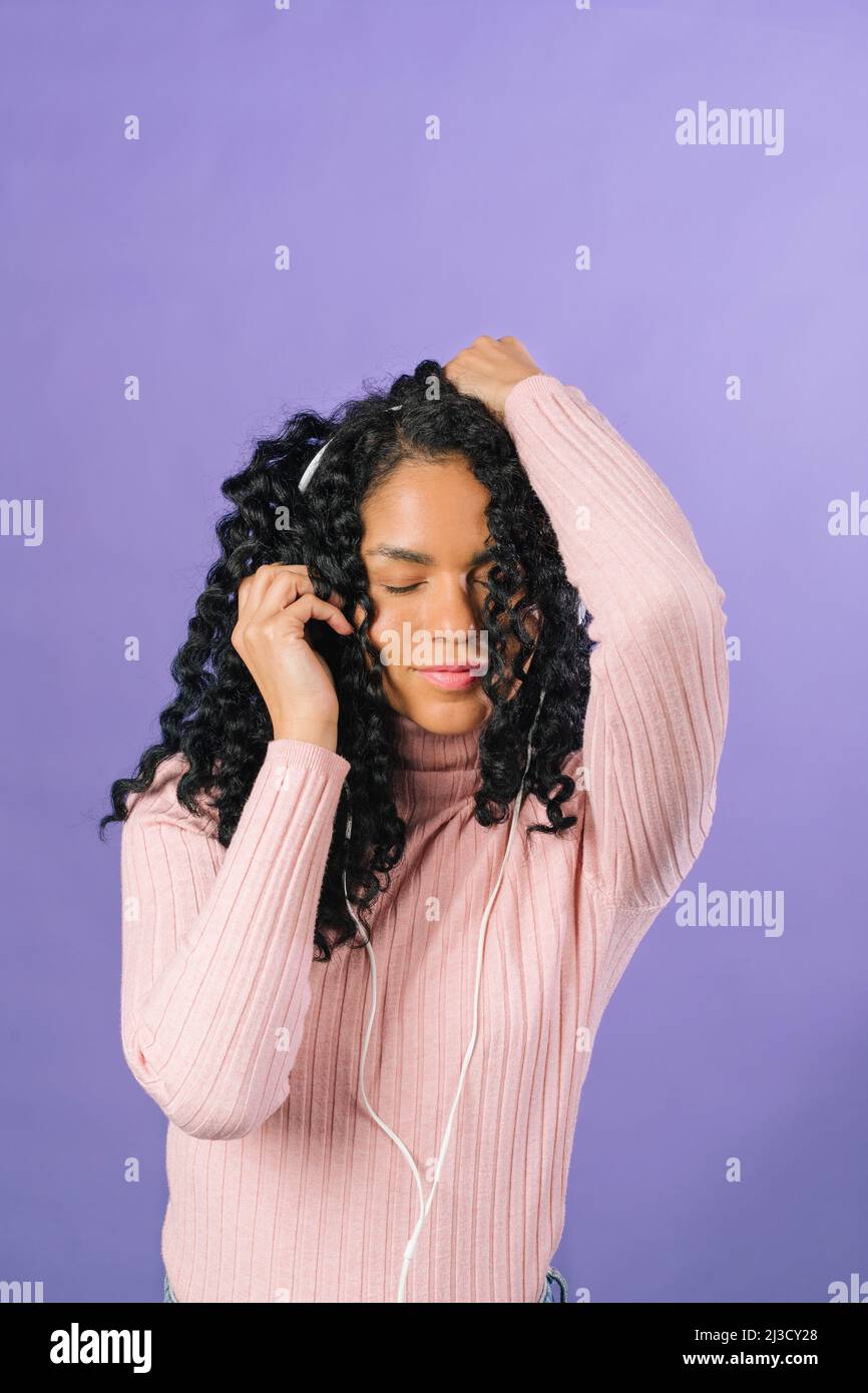 Curly woman listening dance music hi-res stock photography and images ...