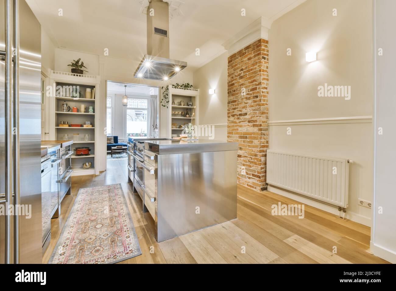 Metal counter placed in spacious stylish kitchen with modern appliances ...