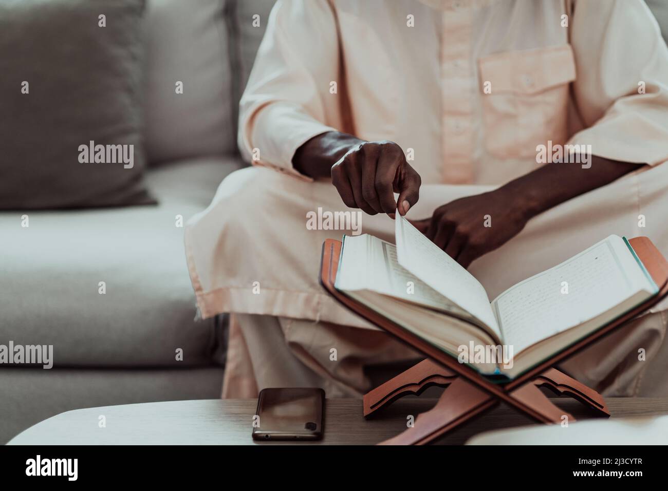 African Muslim couple at home in Ramadan reading Quran holly Islam book ...